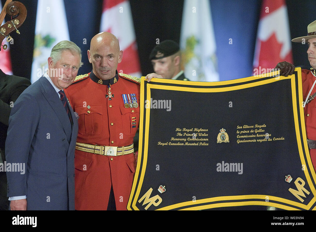 Standing beside RCMP Commissioner Bob Paulson, Prince Charles is made ...
