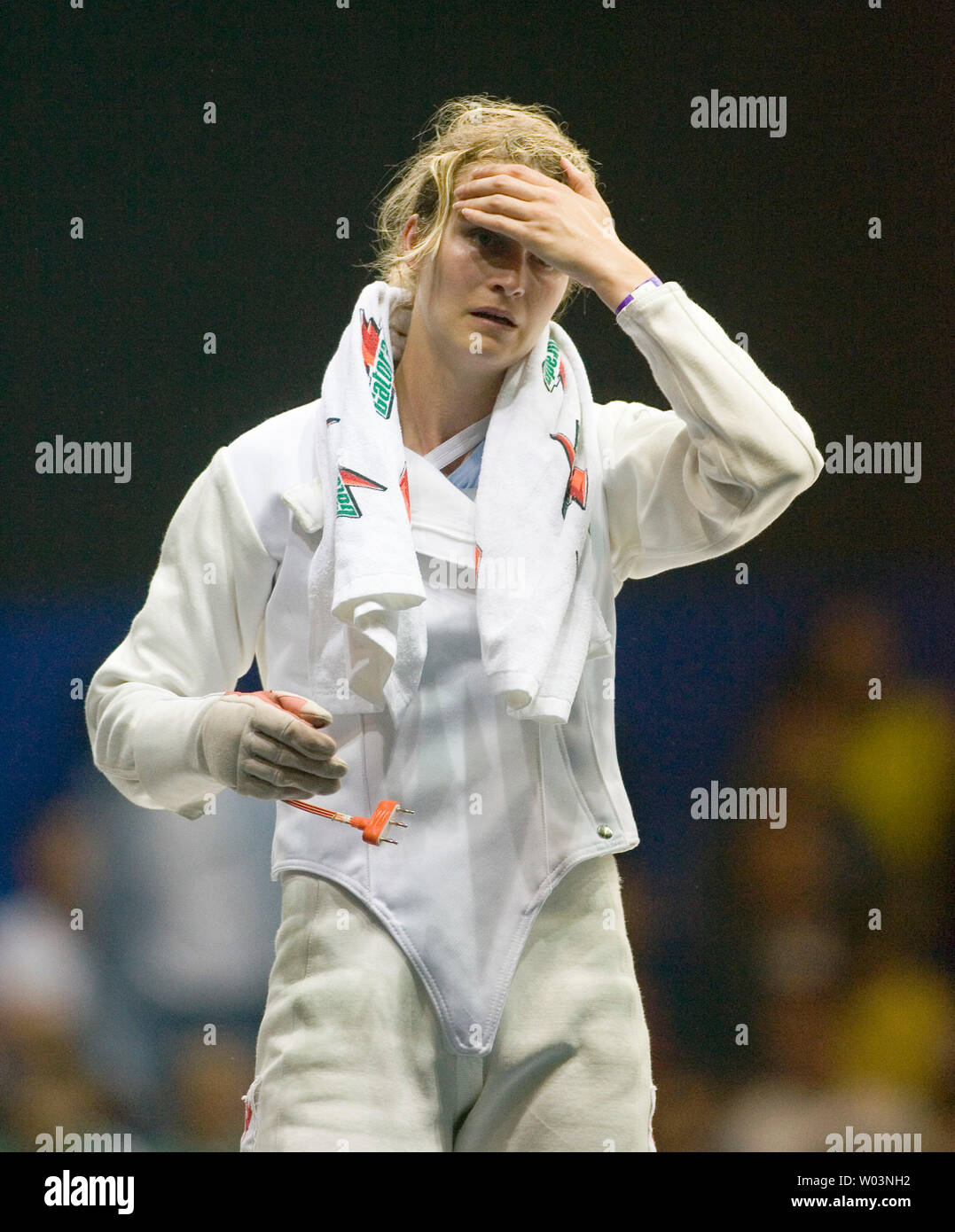 Canada's Julie Leprohon wipes her brow after her loss to USA's Courtney ...