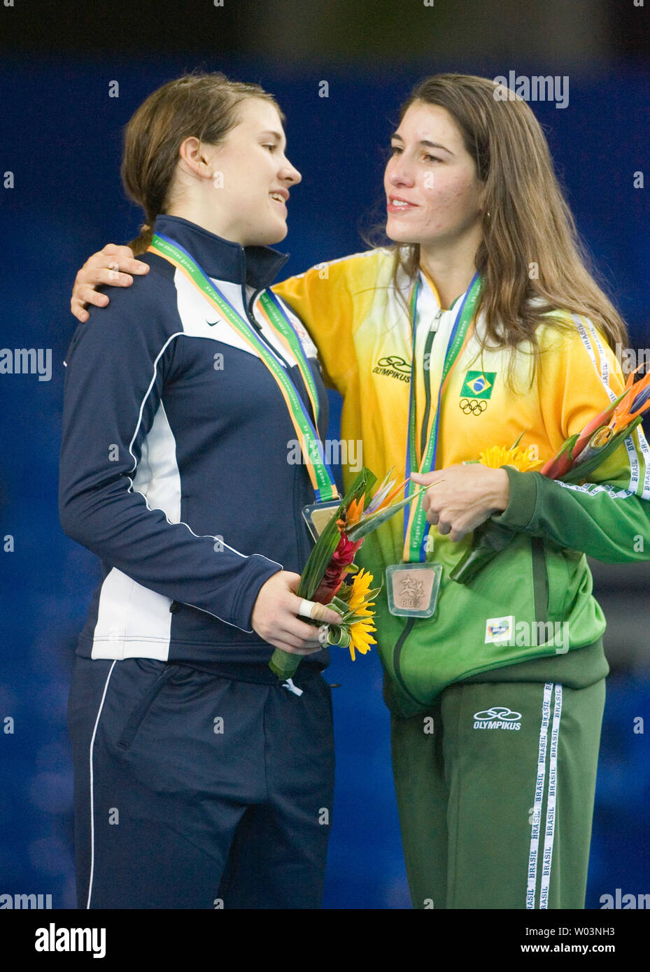 Bronze medalist Clarisse Menezes of Brazil hugs gold medalist Courtney ...