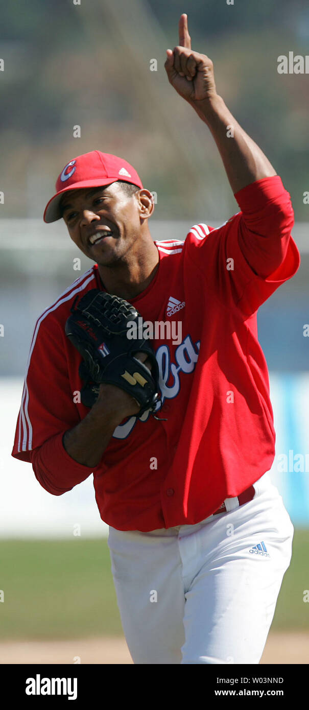 Cuban pitcher Adiel Palma leaves the mound after substitution during ...