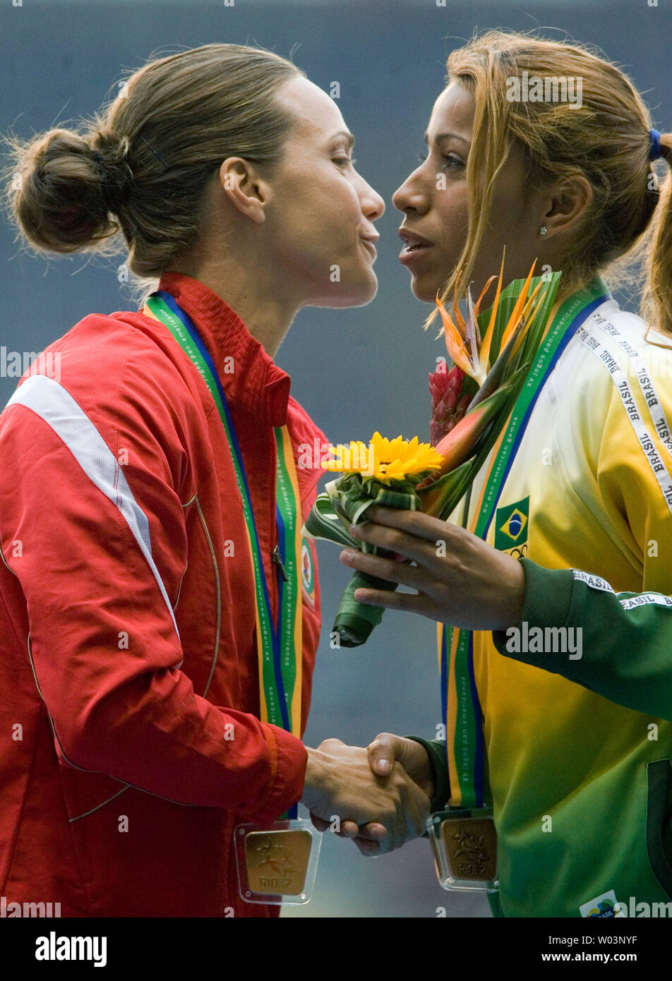 Canada's Heptathlon gold medalist Jessica Zelinka (L) and bronze medalist Lucimara Silva from ...