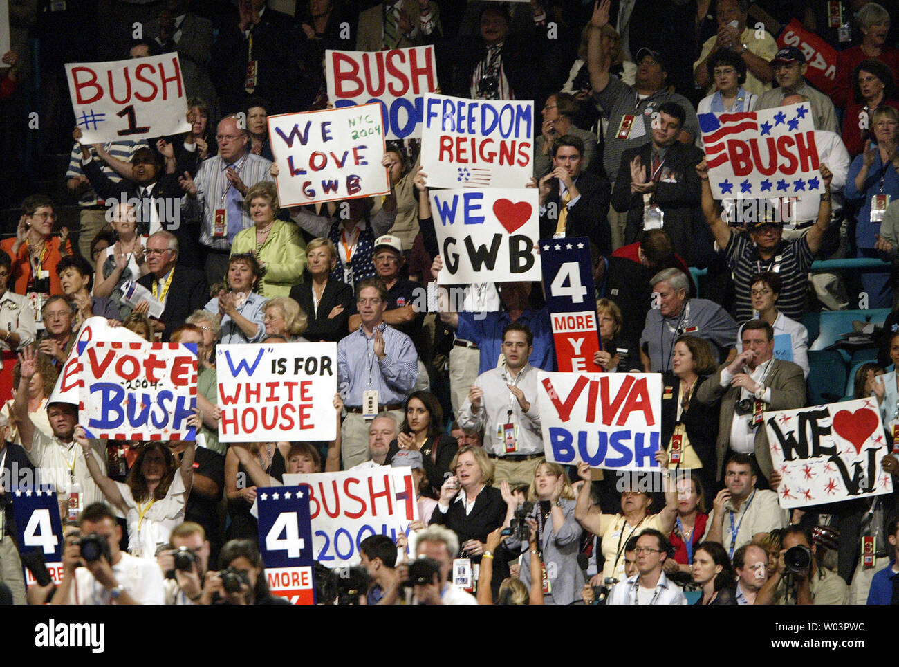 People attending the Republican National Convention wave signs in ...