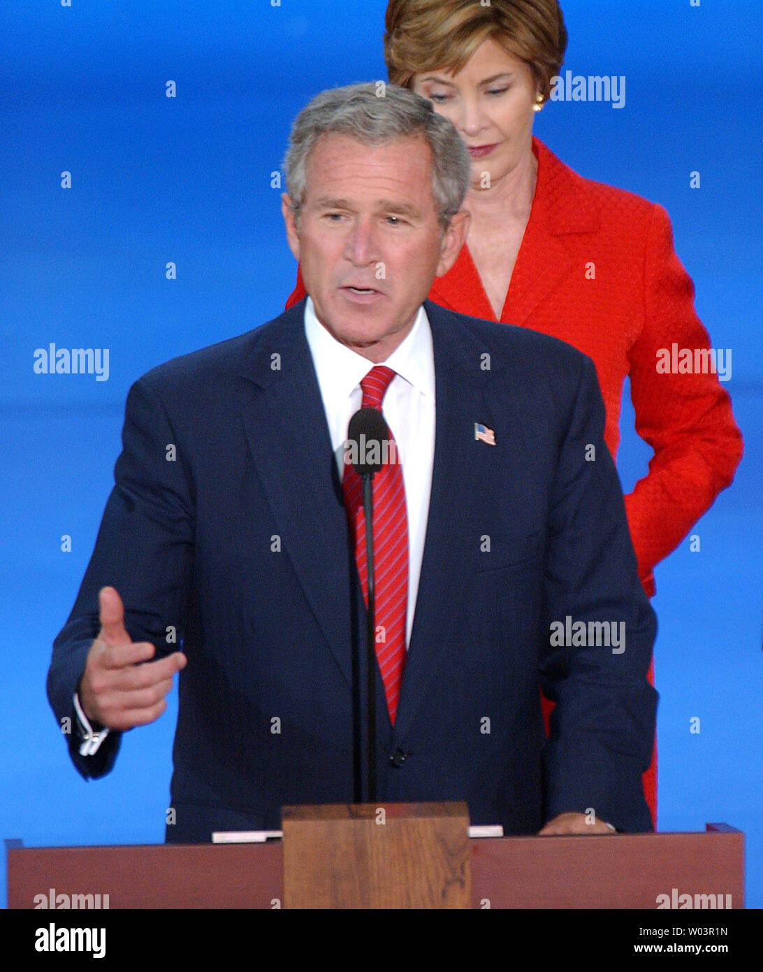 President George W. Bush, with First Lady Laura Bush, looks over the ...