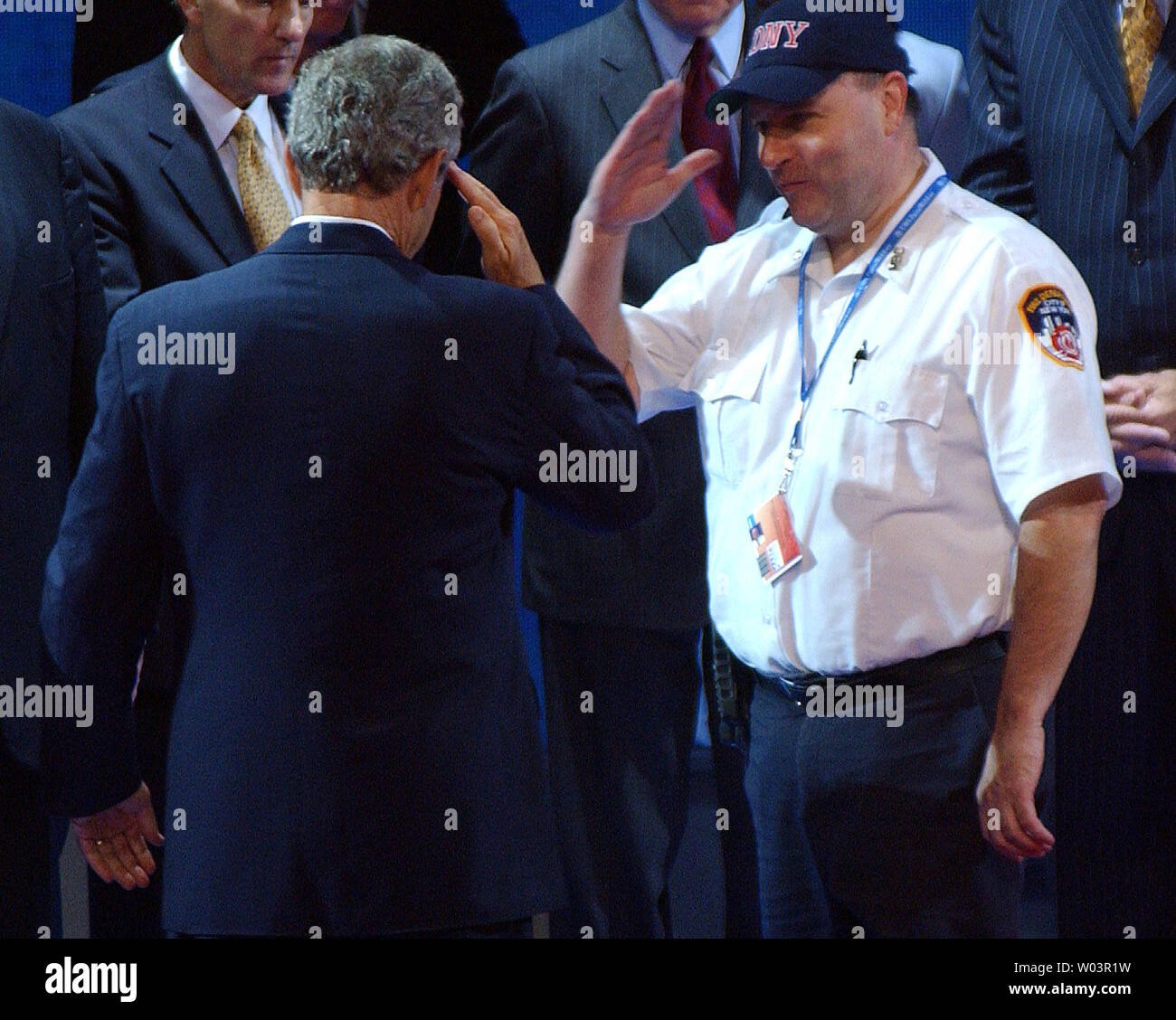 President George W. Bush salutes and New York fire fighter after Bush ...