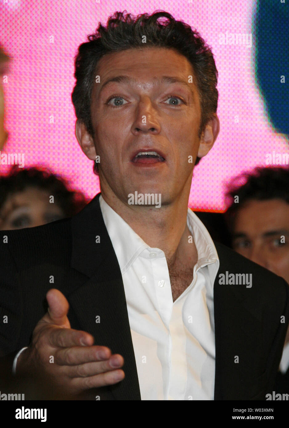 Actor Vincent Cassel gestures on the red carpet before a screening of ...