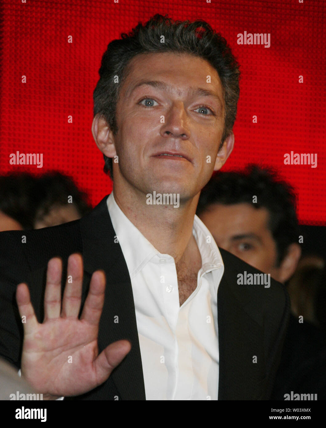 Actor Vincent Cassel gestures on the red carpet before a screening of ...
