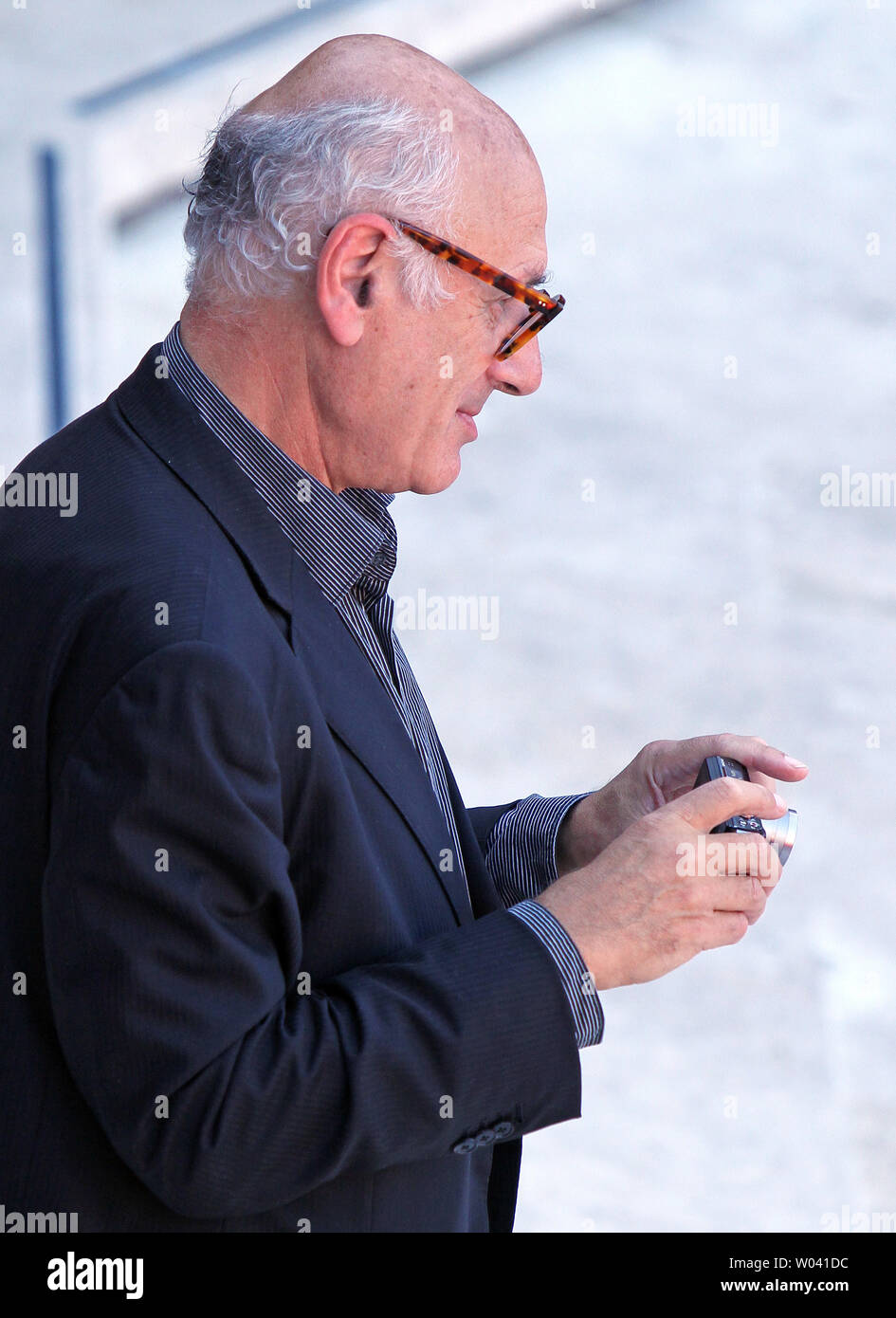 Michael Nyman takes a photo after arriving on the red carpet during the ...