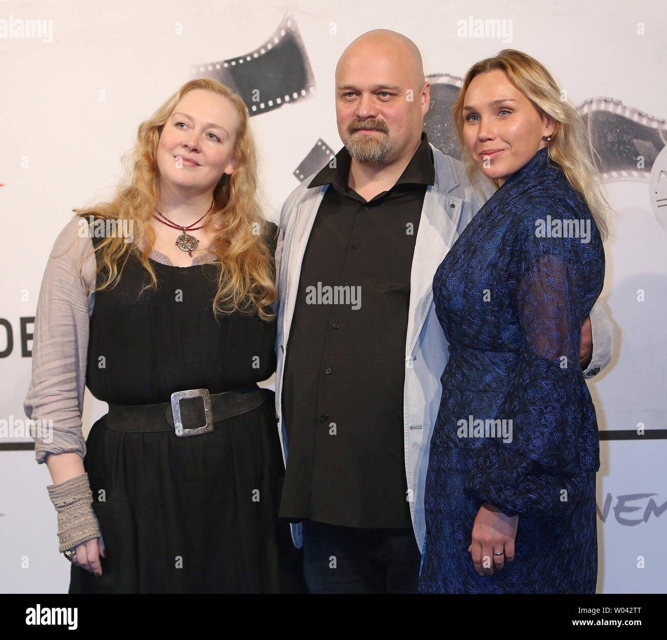 Julia Aug (L), Aleksei Fedorchenko (C) and Darya Ekamasova arrive at a ...