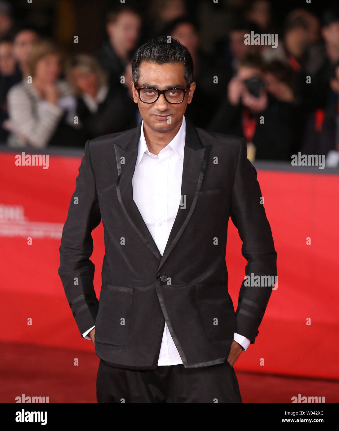 Qaushiq "Q" Mukherjee arrives on the red carpet for the film "Tasher ...
