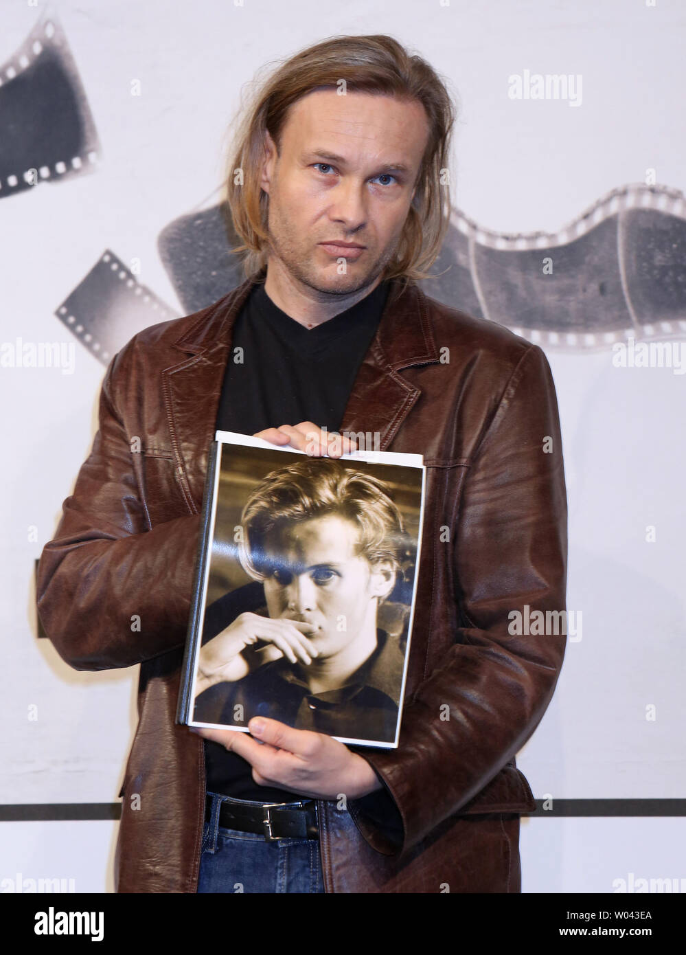 Michal Skolimowski, holding a photo of his brother screenwriter Jozef ...
