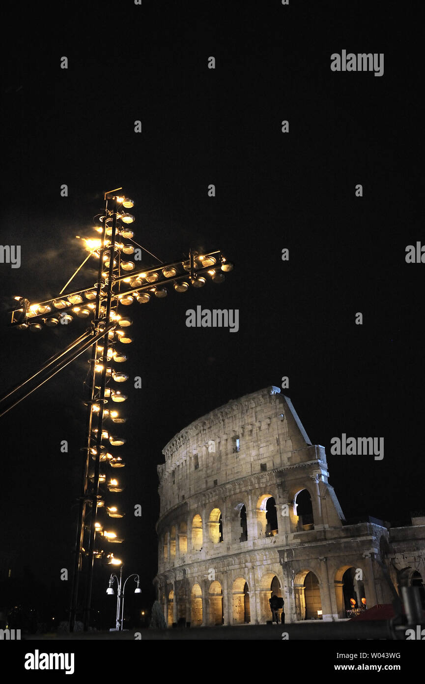 A cross stands during the Via Crucis (Way of the Cross) torchlight ...
