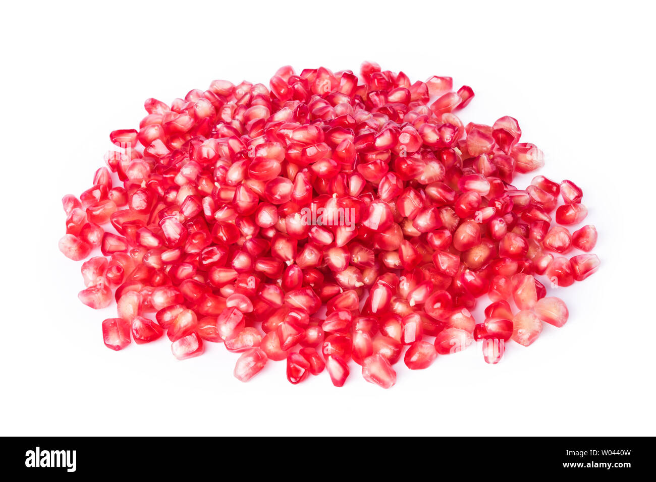 Pomegranate seeds on white background Stock Photo - Alamy