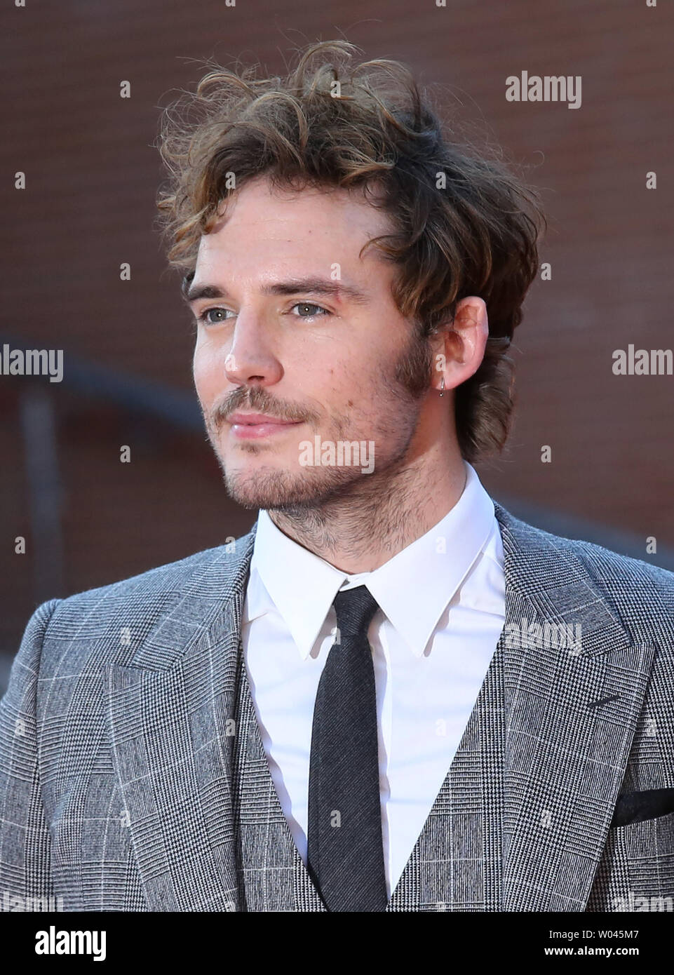 Sam Claflin arrives on the red carpet before the screening of the film ...