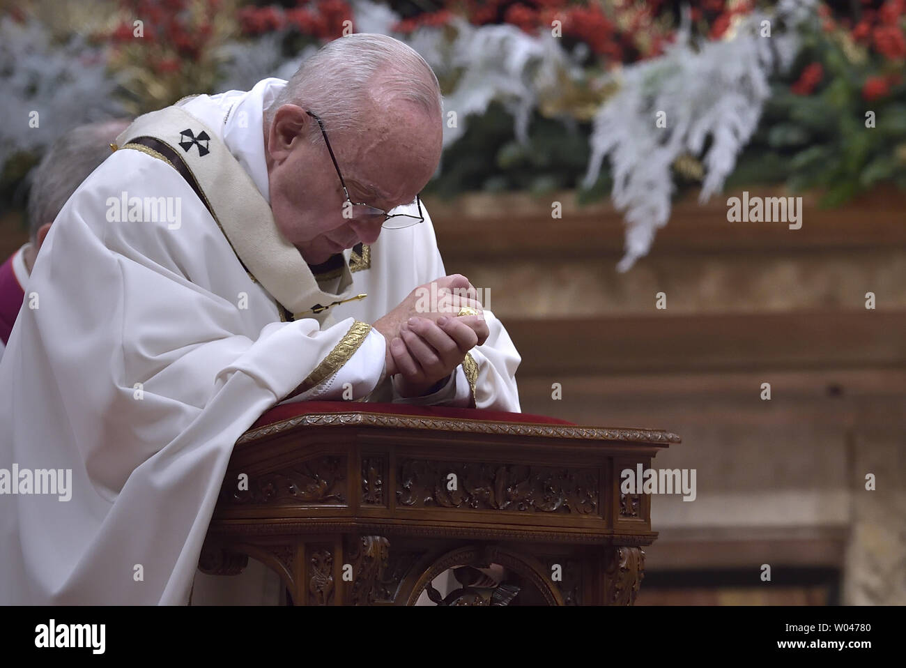 Pope Francis serves Christmas Eve Mass at midnight on December 24, 2017 ...