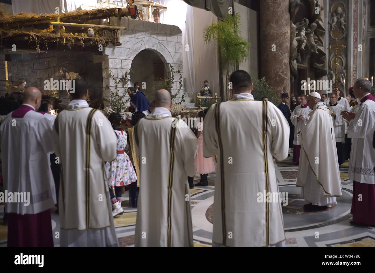 Pope Francis serves Christmas Eve Mass at midnight on December 24, 2017 ...