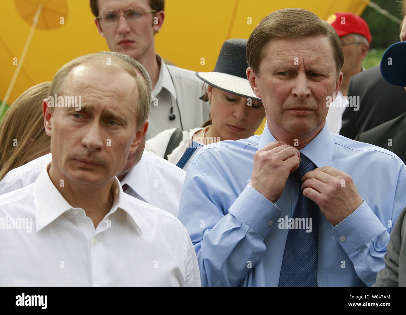 Russian President Vladimir Putin (L) accompanied by First Deputy Prime ...