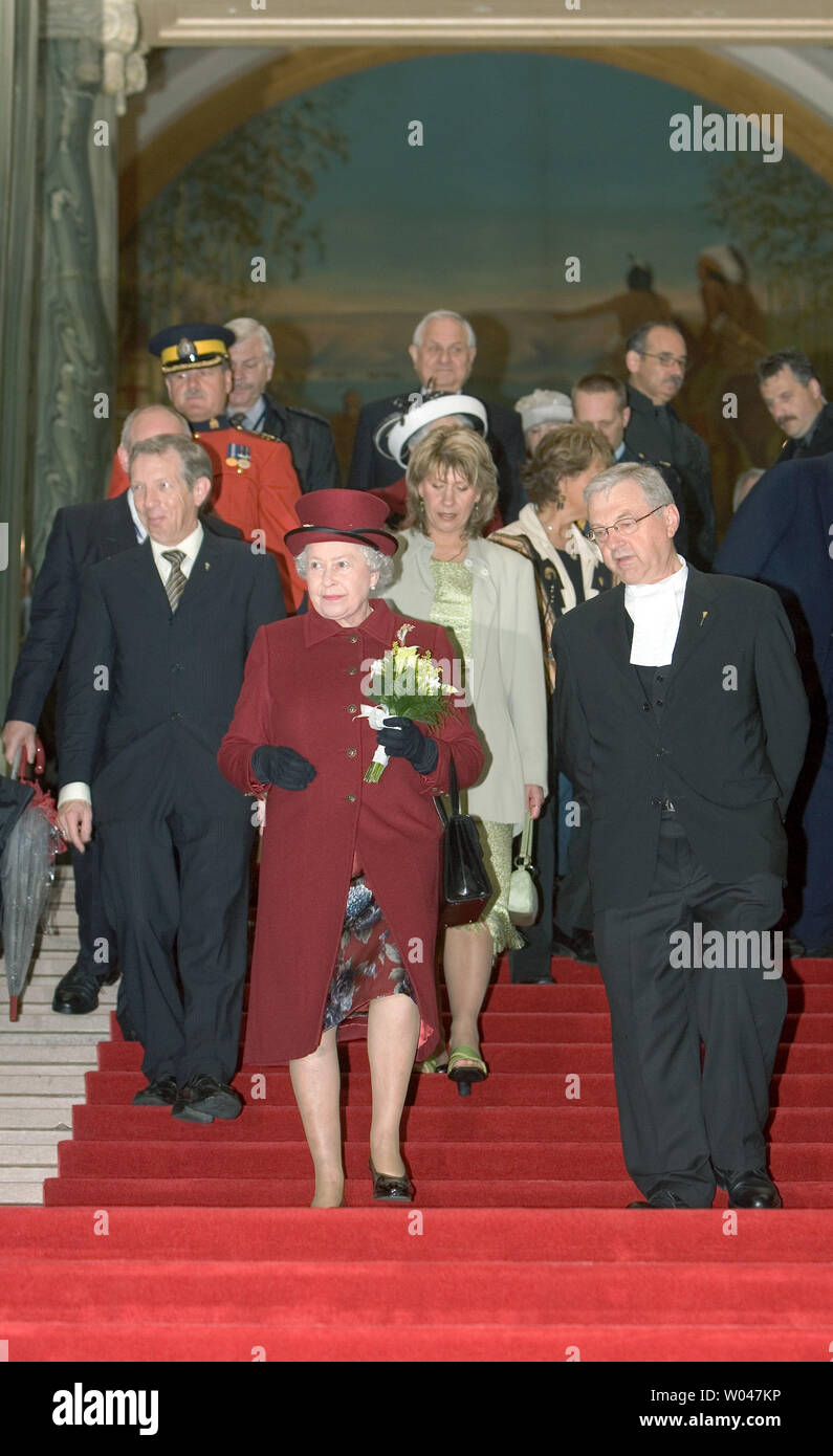 Queen Elizabeth of Great Britain comes down the stairs from the rotunda ...