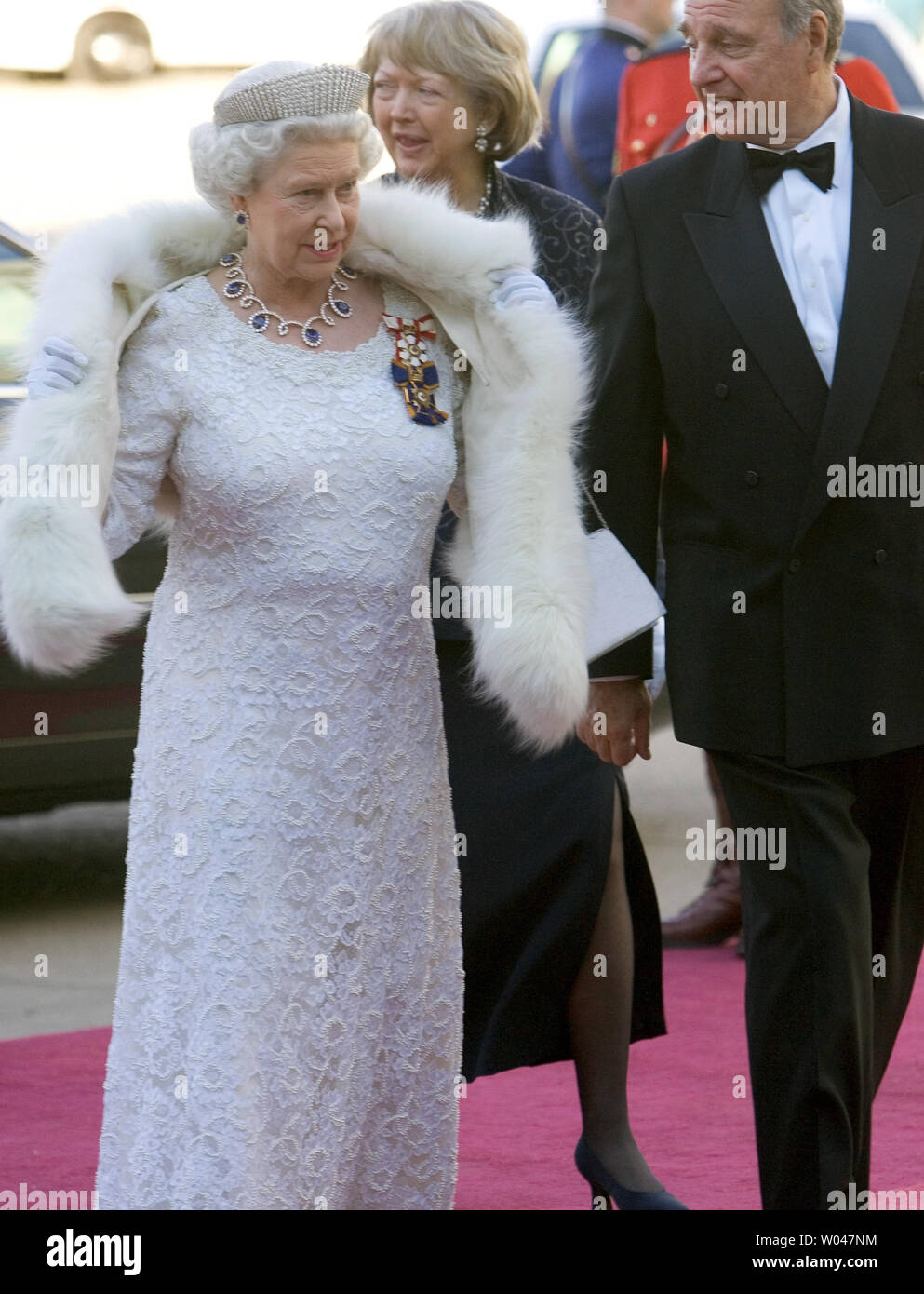 Queen Elizabeth is escorted by Canada's Prime Minister Paul Martin to ...
