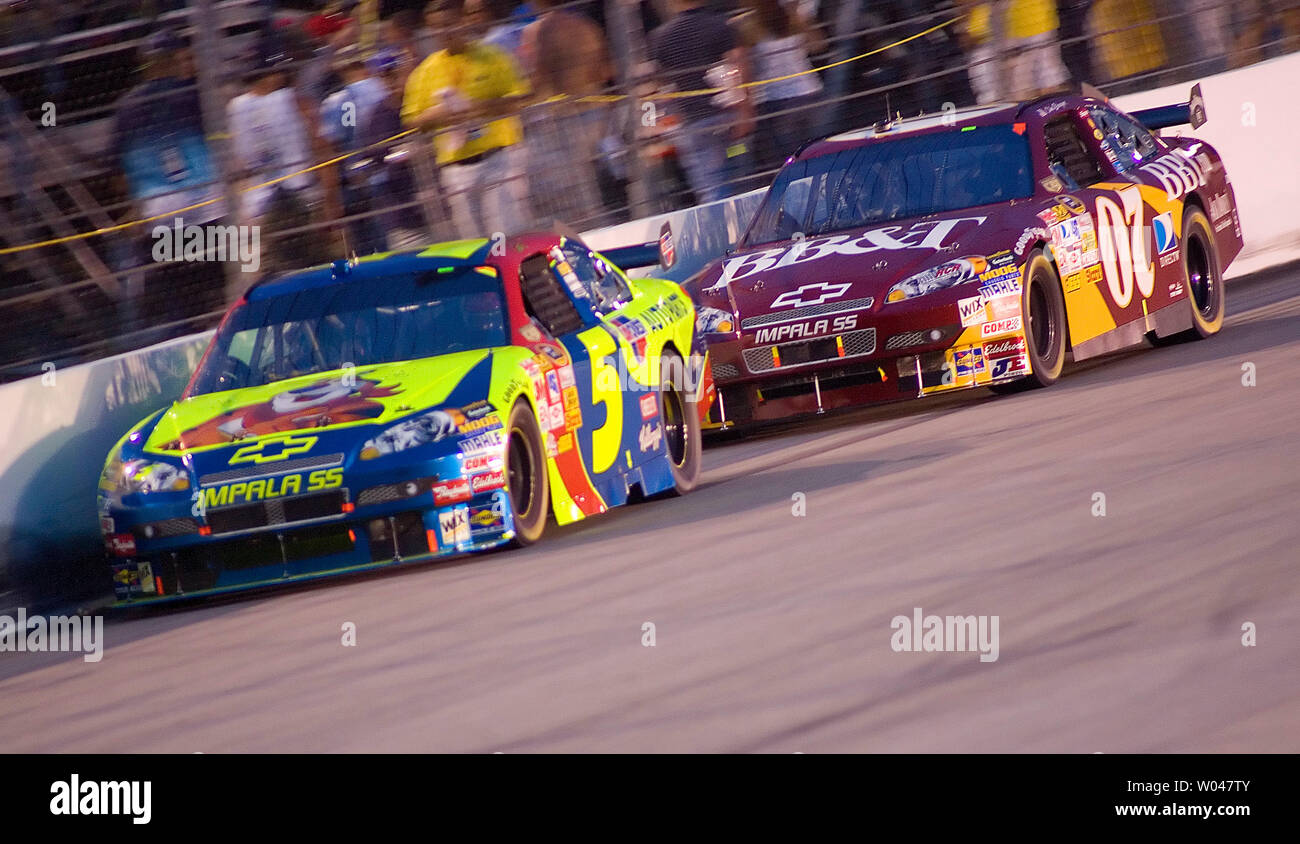 Casey Mears (5) drives down the back stretch in front of Clint Bowyer ...