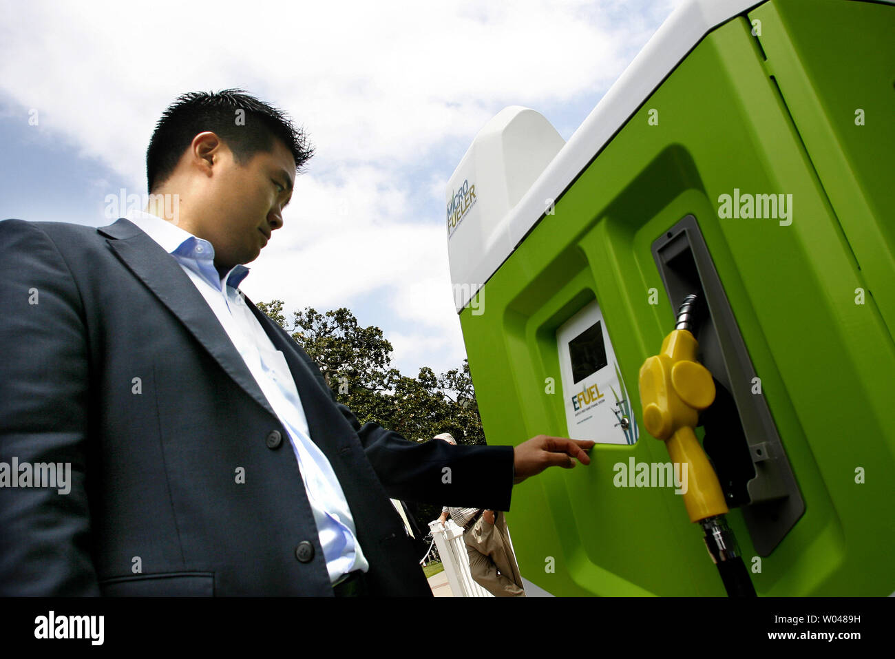 Albert Lee from New York looks over The E-fuel 100 MicroFuelerª, a ...