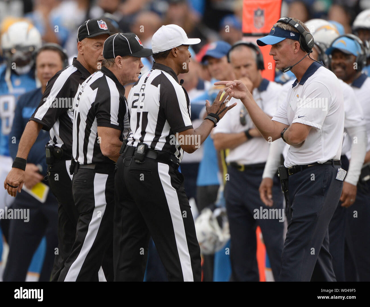 San Diego Chargers head coach Mike McCoy speaks to head referee Jerome ...