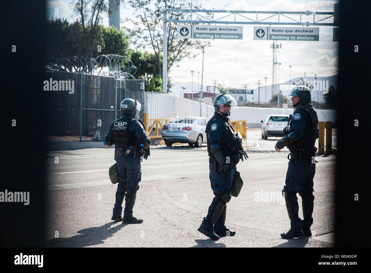 U.S.Customs and Border Protection agent walk near the Otay Mesa Port of ...