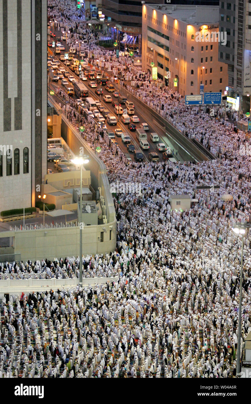 Muslim pilgrims pray in street next to the birthplace of prophet ...
