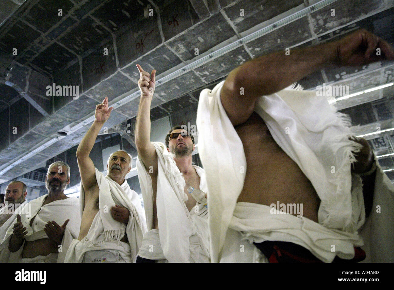 Muslim pilgrims stone one of three pillars in a ritual called 'Jamarat ...