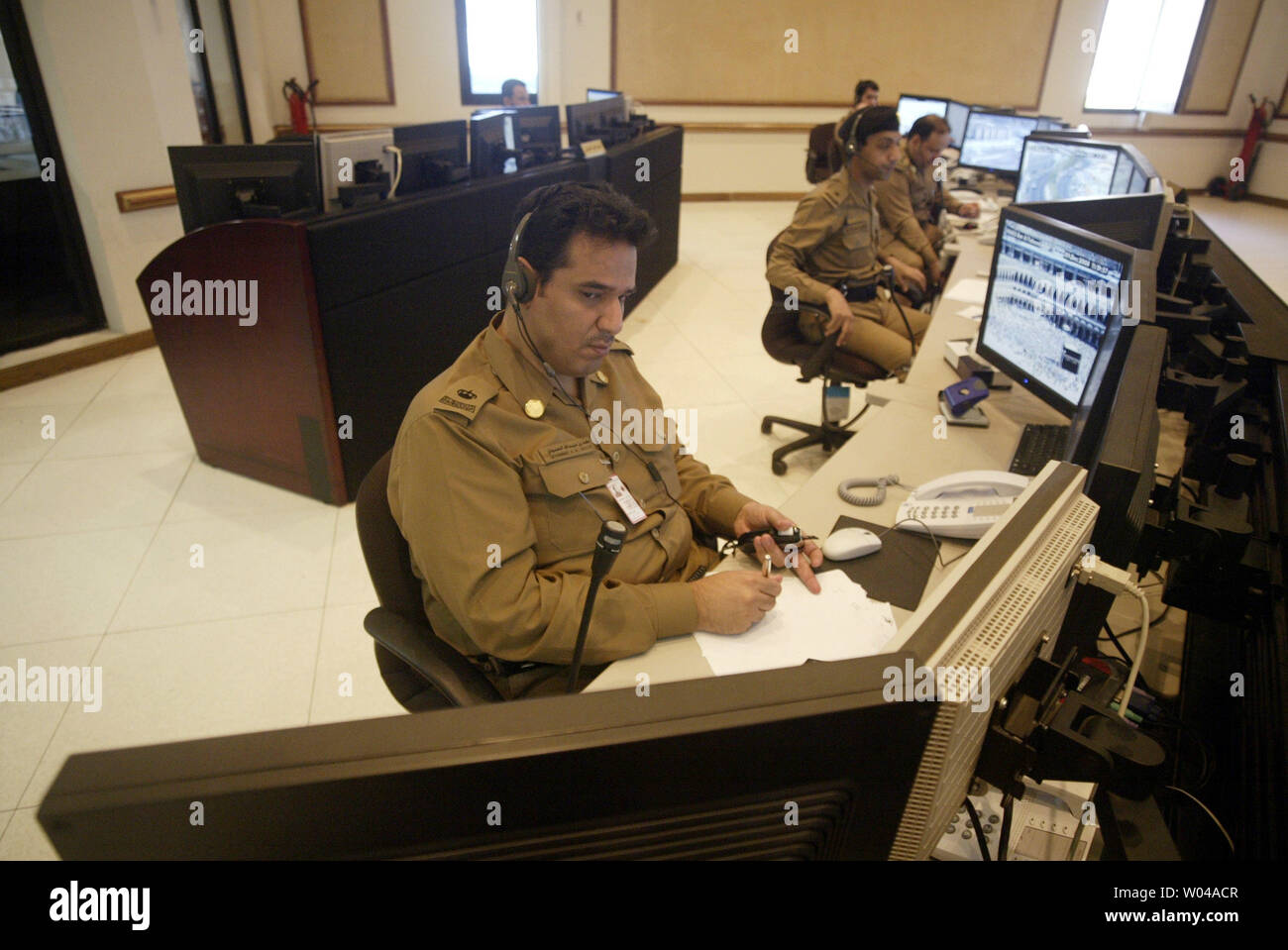 Saudi security officers monitor the valley of Mina through surveillance ...