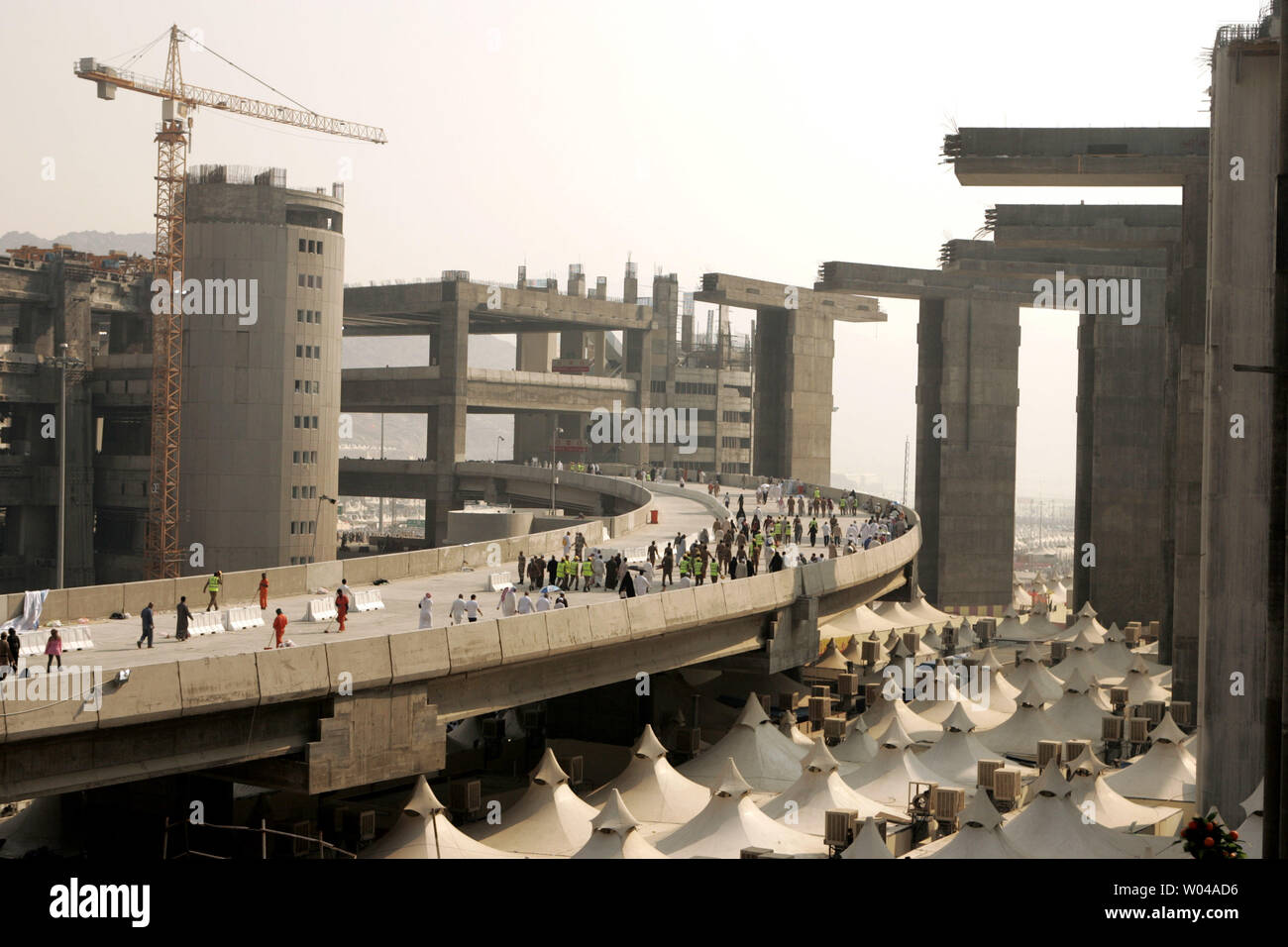 Mina's tents are seen at right while Muslim pilgrims headed to stone ...