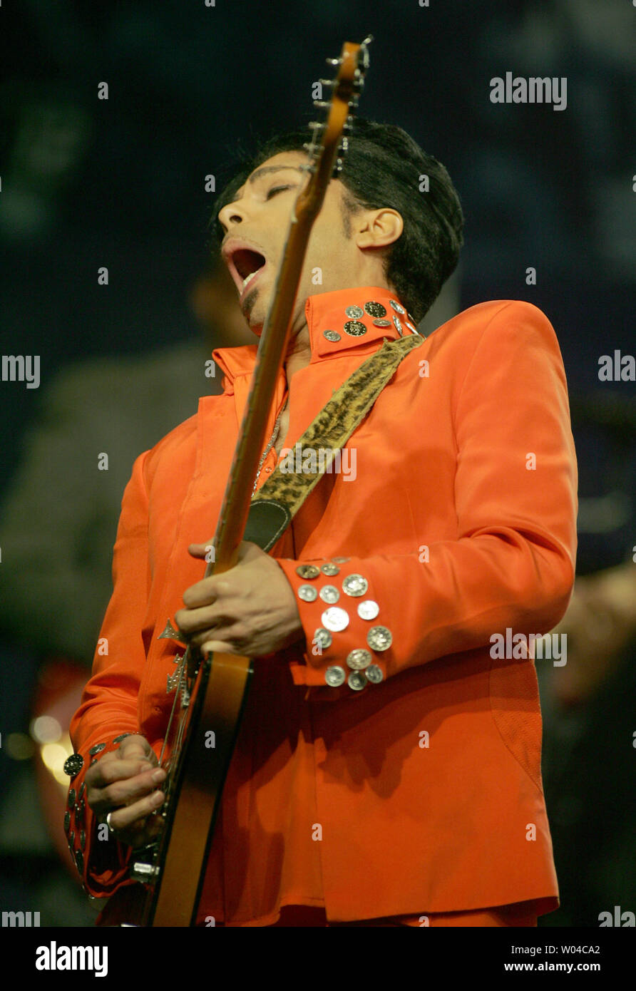 Prince performs for the media at a press conference for the halftime ...