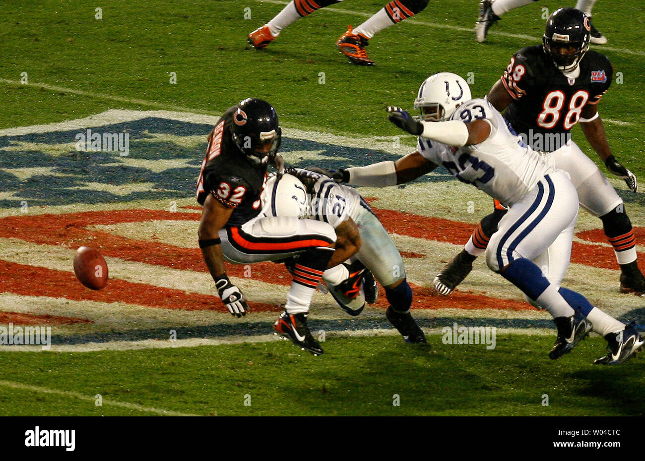 Chicago Bears running back Cedric Benson (35) fumbles the ball which is ...