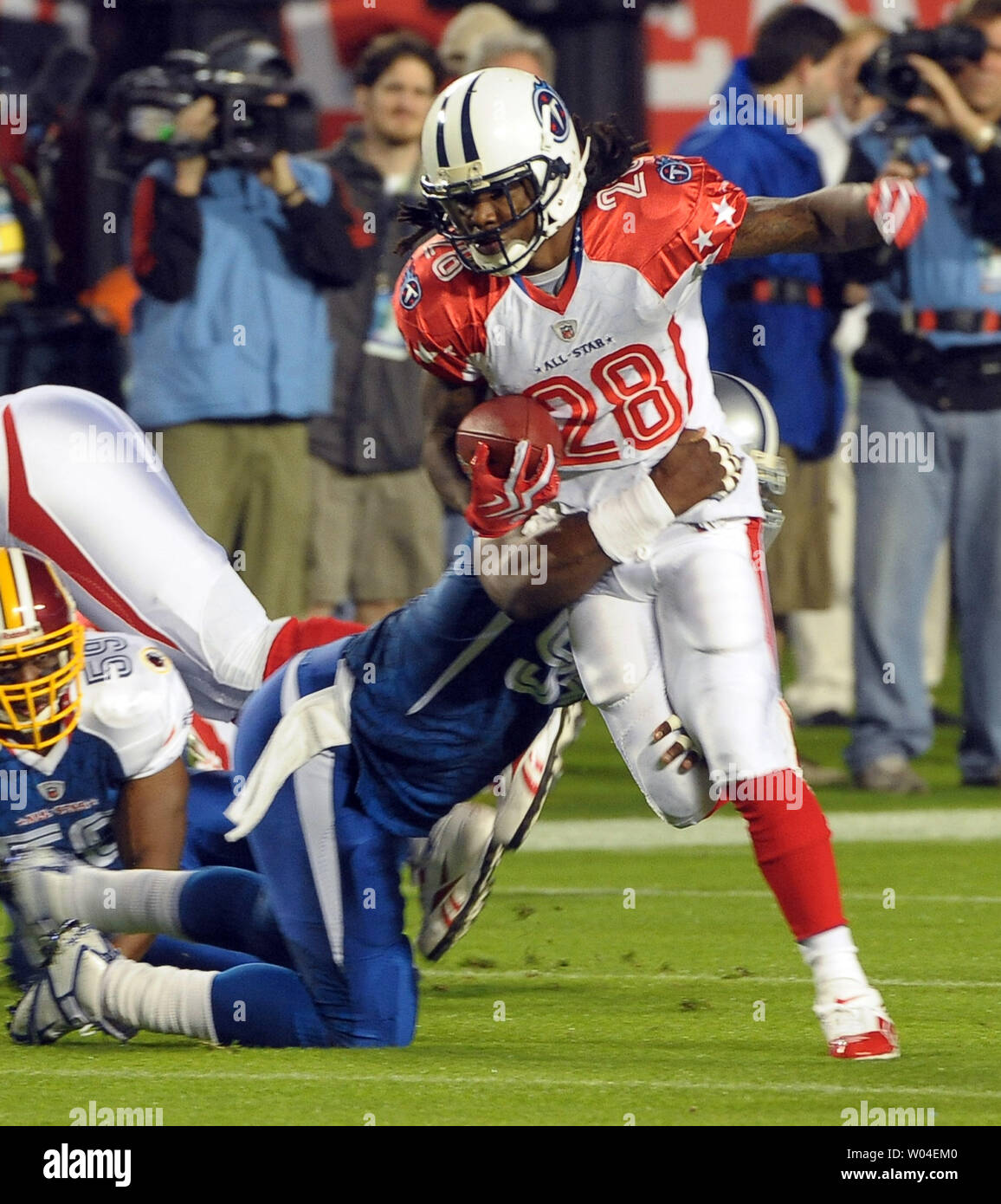 Tennessee Titans running back Chris Johnson picks up yards in the first ...