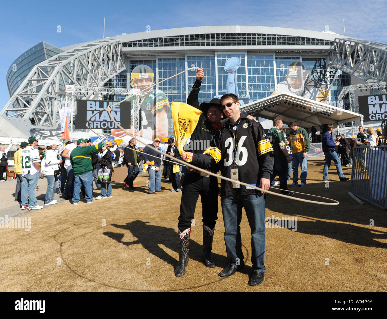 A cowboy swings his lasso around a Pittsburgh Steelers fan before Super ...