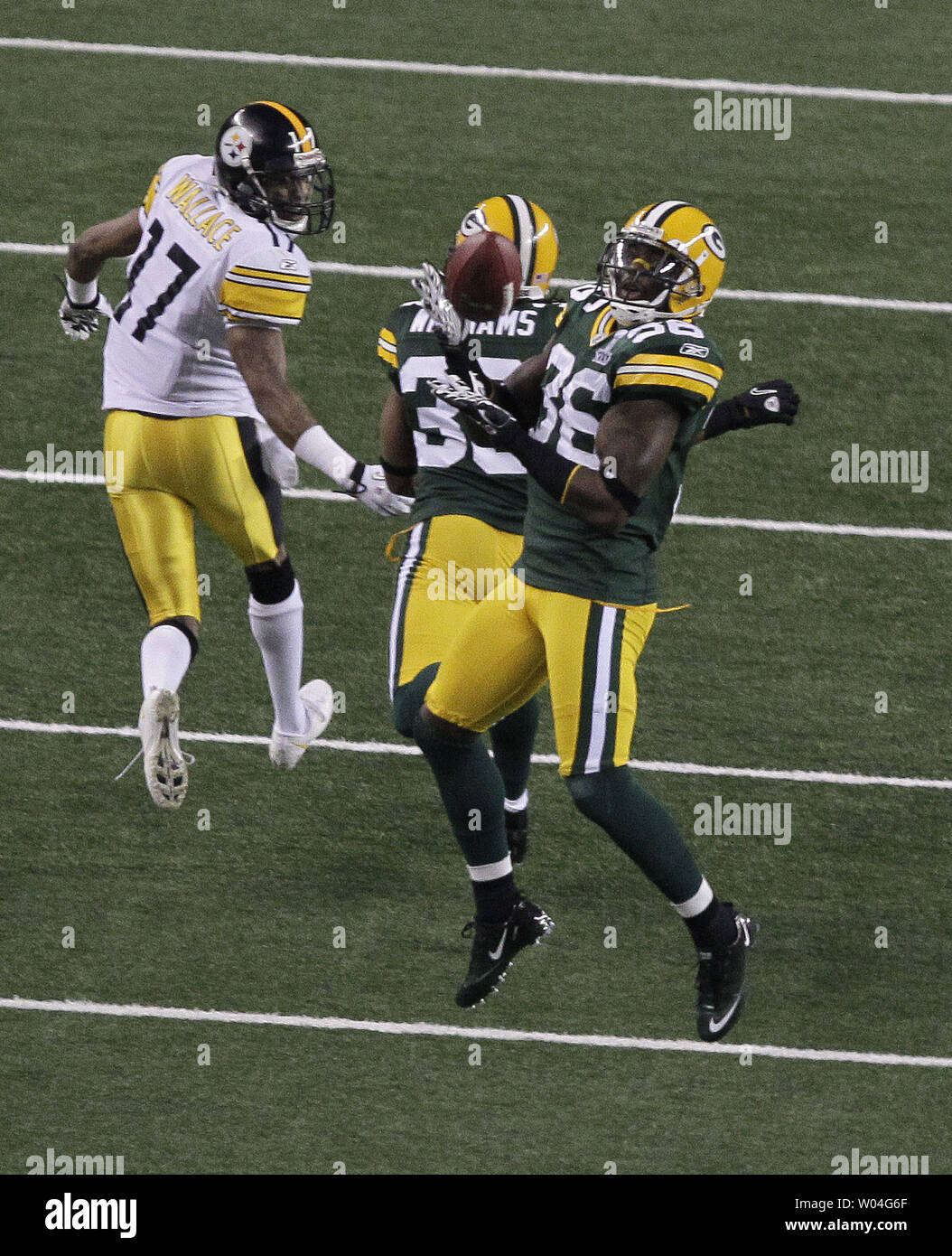 Green Bay Packers safety Nick Collins hauls in an interception against ...