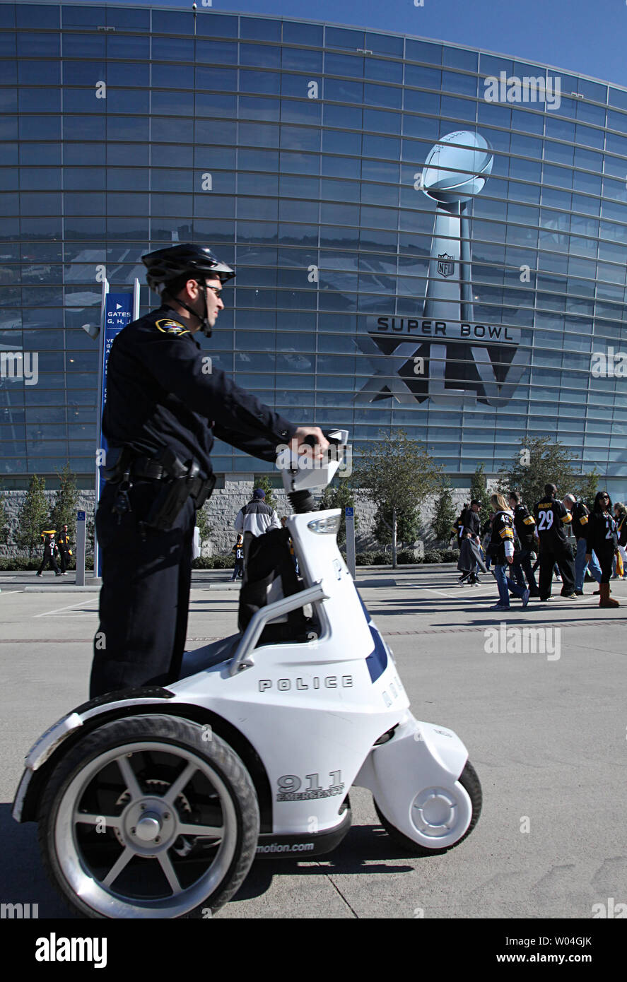 A police officer patrols on a three-wheeled security vehicle before ...