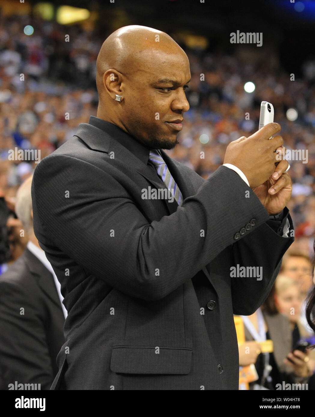 Jarrett Payton, son of Walter Payton, takes pictures as the Super Bowl ...