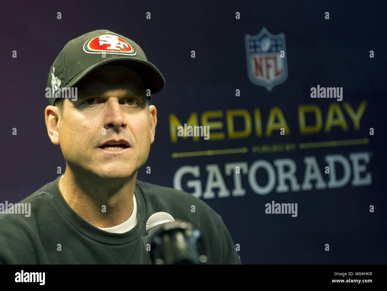 San Francisco 49ers head coach Jim Harbaugh speaks to the media during ...