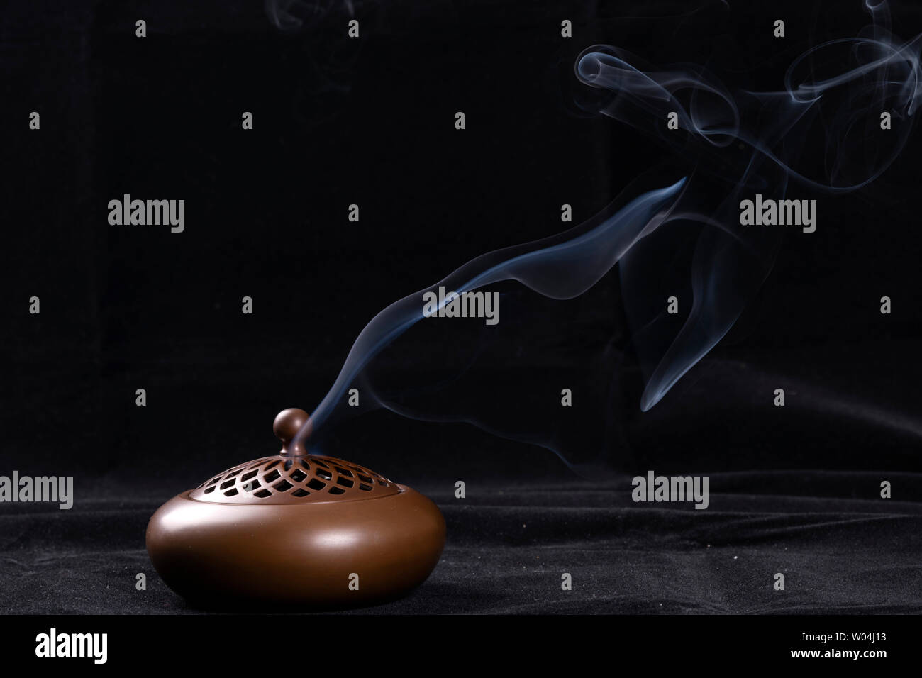 Copper incense stove Stock Photo - Alamy