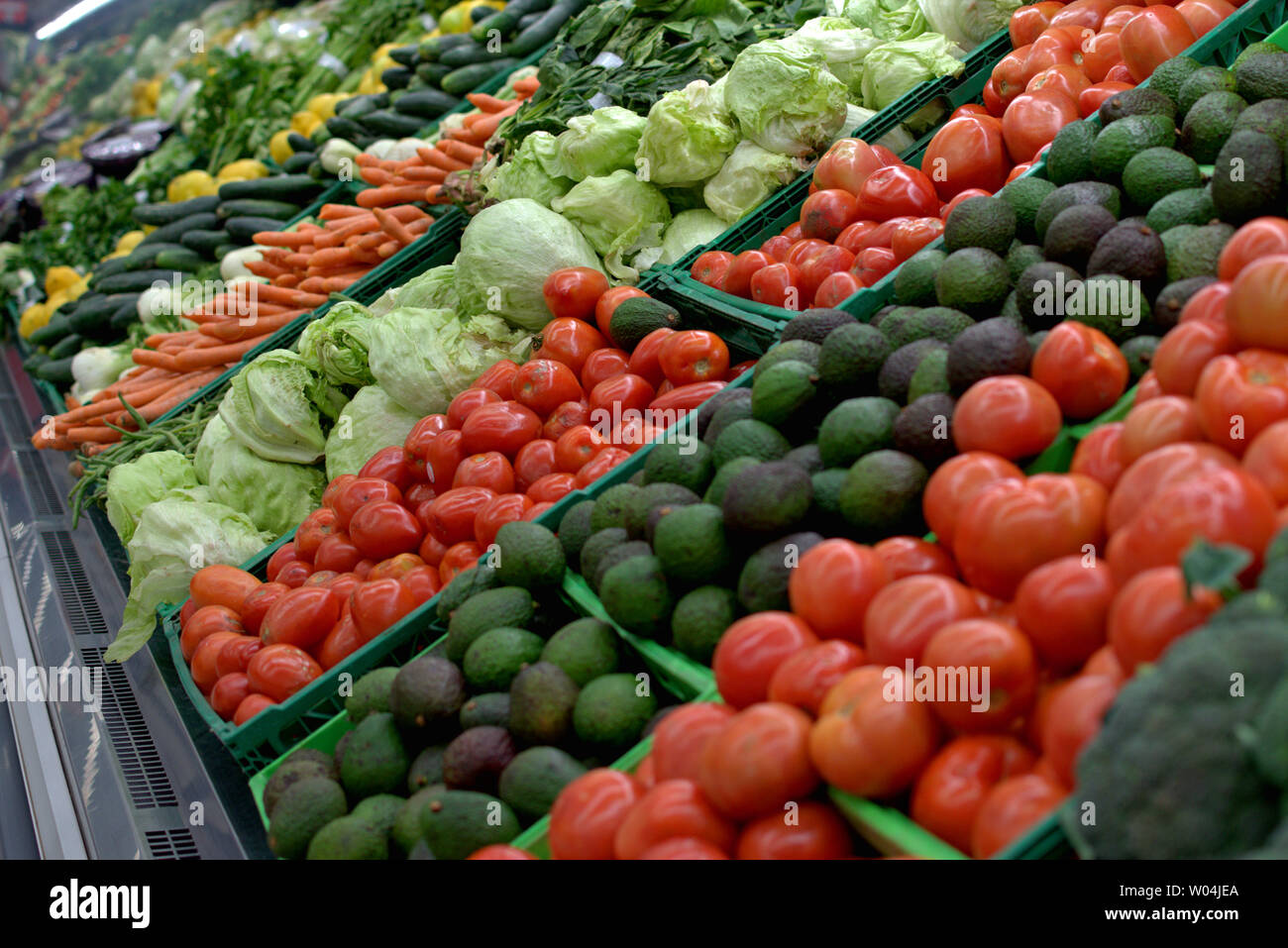 A supermarket aisle full of fresh, colorful vegetables Stock Photo - Alamy