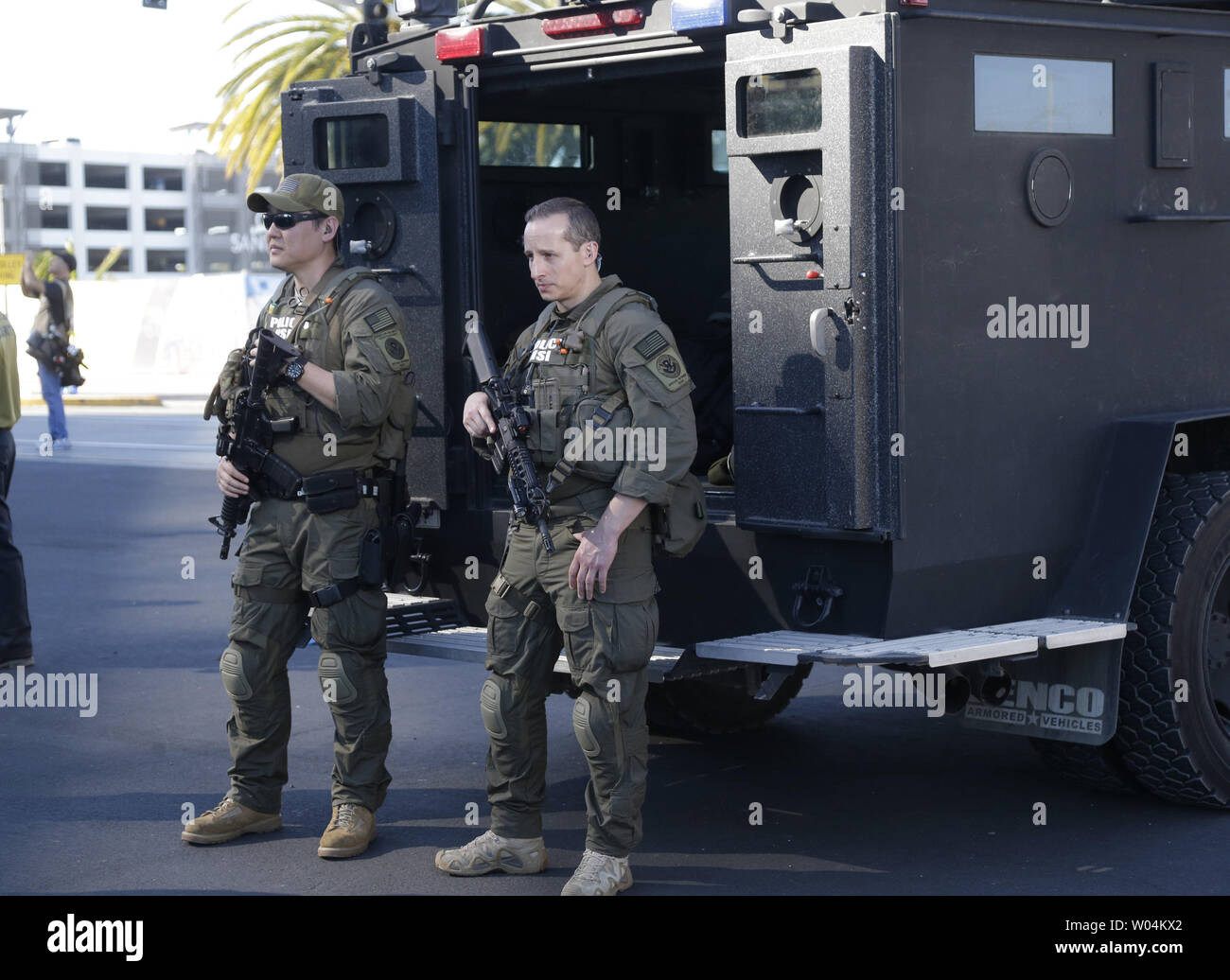 Security stands guard with assault weapons outside Levi's Stadium at ...