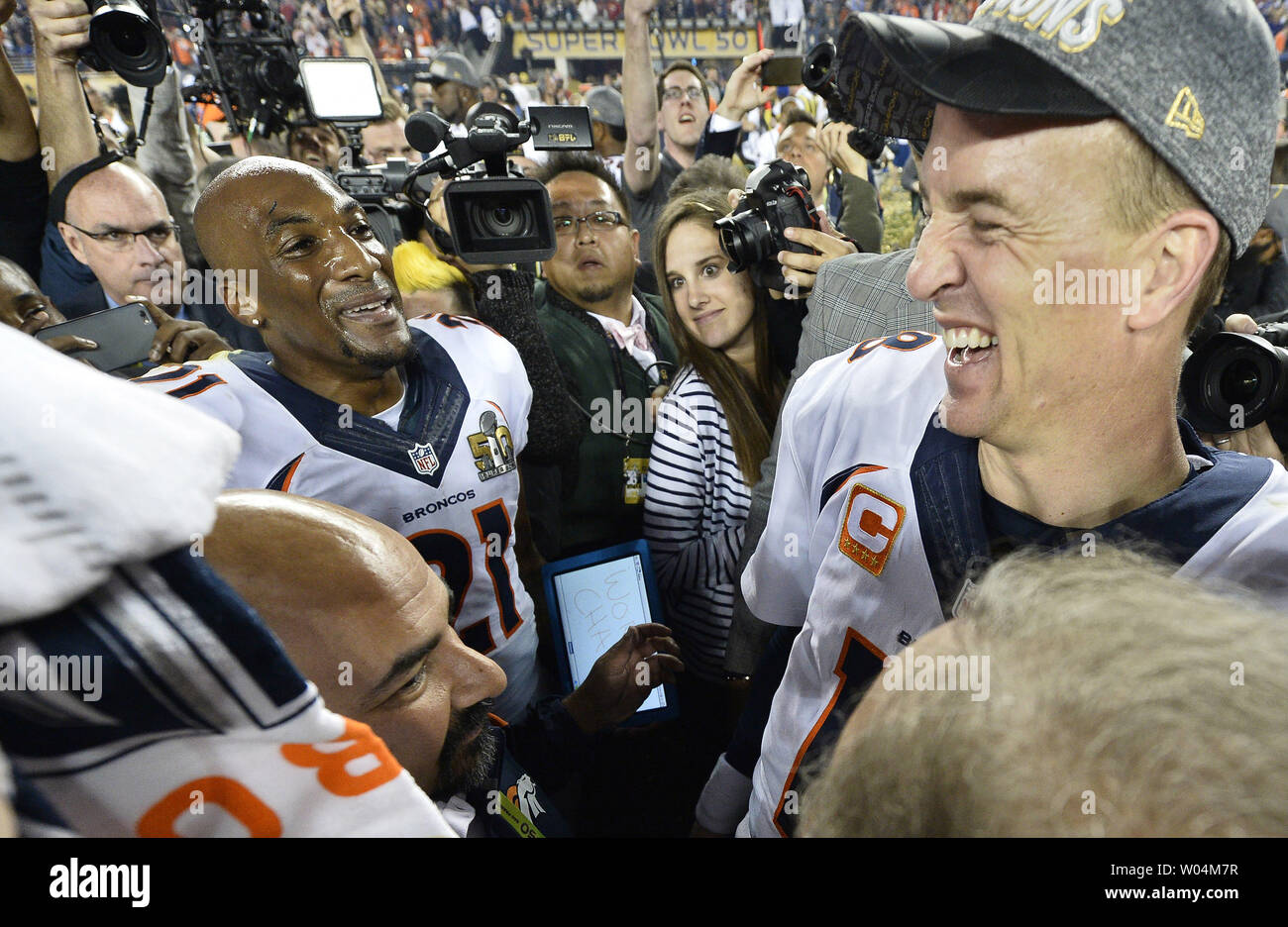 Denver Broncos quarterback Peyton Manning celebrates with cornerback ...