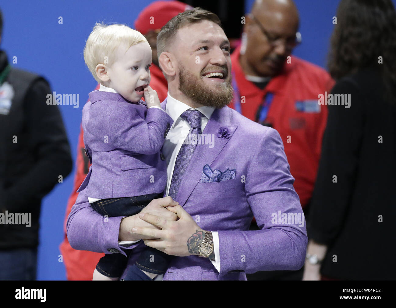 MMA star Conor McGregor watches holding his son, Conor Jack McGregor ...