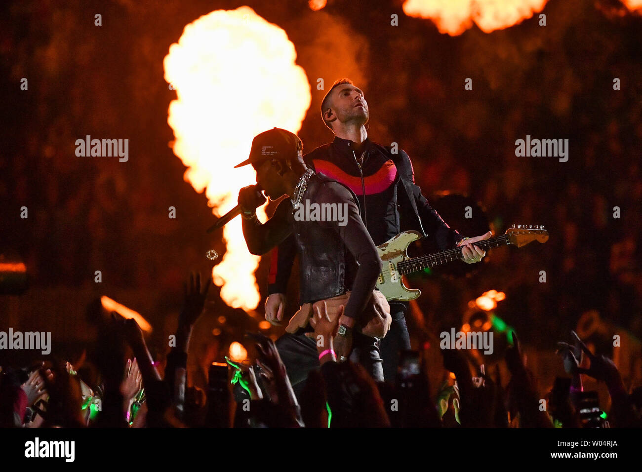Rapper Travis Scott (L) and Adam Levine of Maroon 5 perform during the ...
