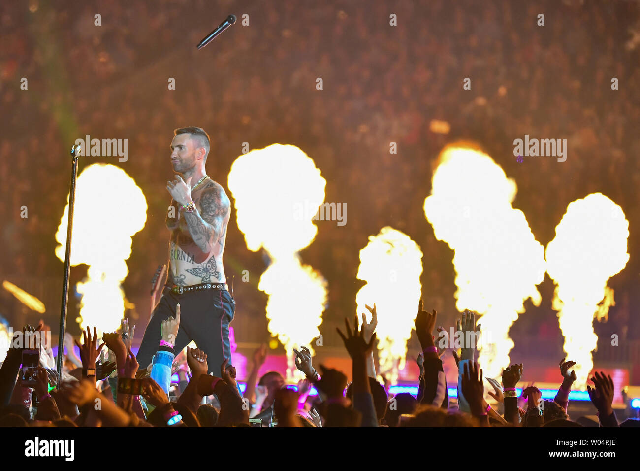 Adam Levine, lead singer of the band Maroon 5 tosses his microphone ...