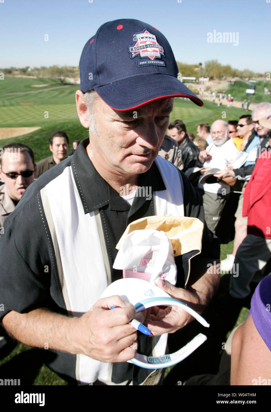 Comedian Bill Murray grabs a bunch of hats to sign after completing the ...