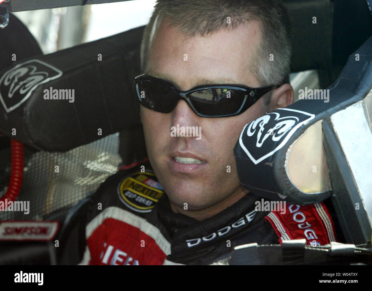 Race car driver Jeremy Mayfield sits in his race car before NASCAR ...