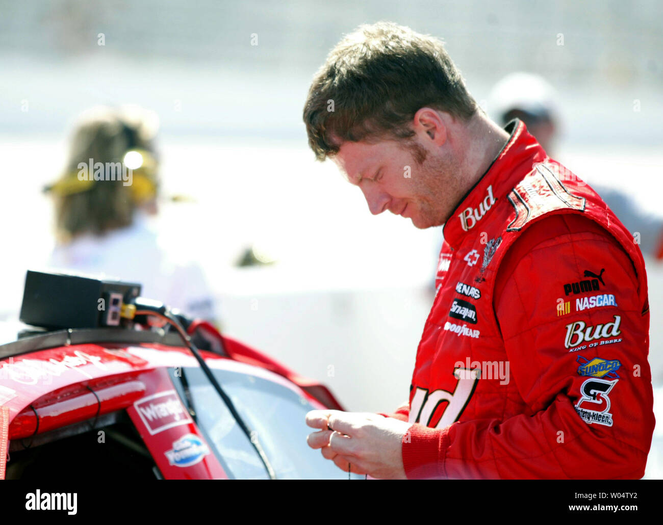 Race car driver Dale Earnhardt, Jr spends a quiet moment before NASCAR ...