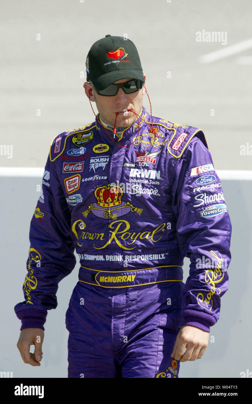 Race car driver Jamie McMurray looks over his race car before NASCAR ...
