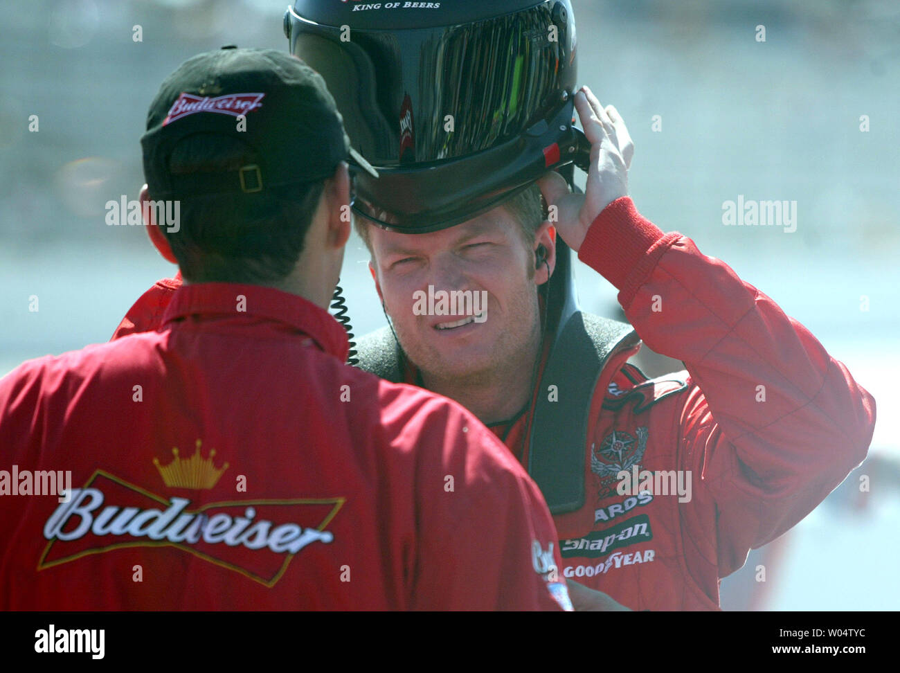 Race car driver Dale Earnhardt, Jr., right, puts on his helmet before ...